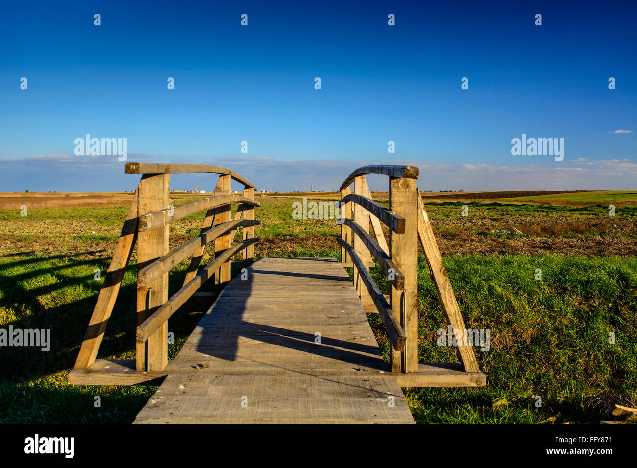 The wooden bridge built for safe crossing over the excavated ...