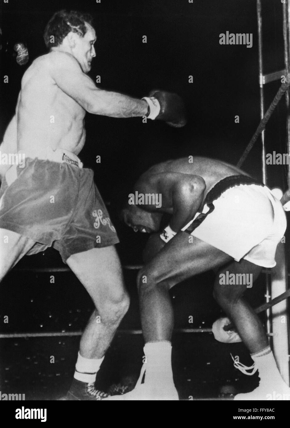 COOPER AND ALI, 1966. /nBoxer Henry Cooper (left) swings at Muhammad ...