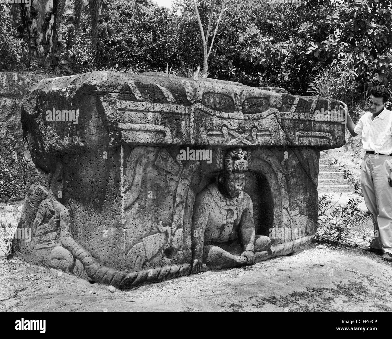 MEXICO: OLMEC MONUMENT. /nMan standing beside an Olmec stone altar or ...