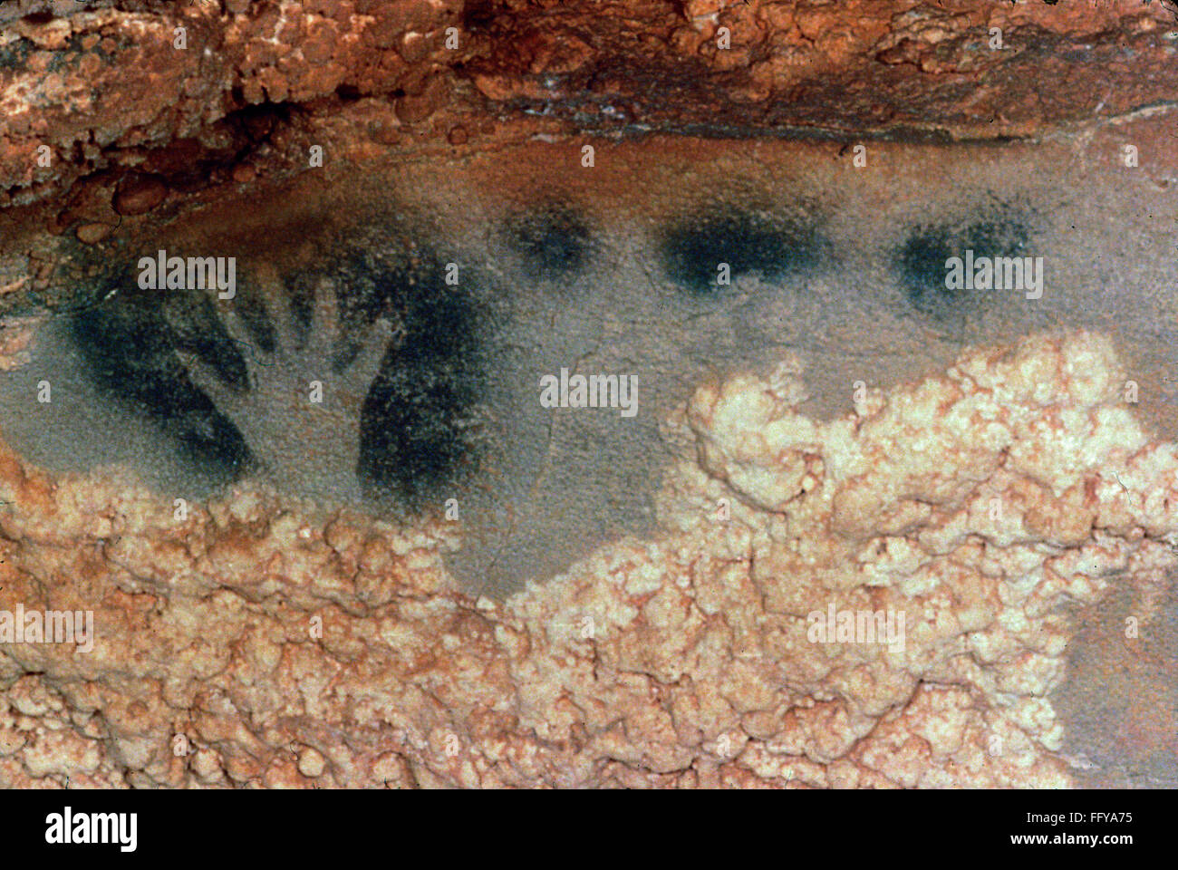 CAVE ART: PECH MERLE. /nHuman handprint and painted dots on a wall of ...