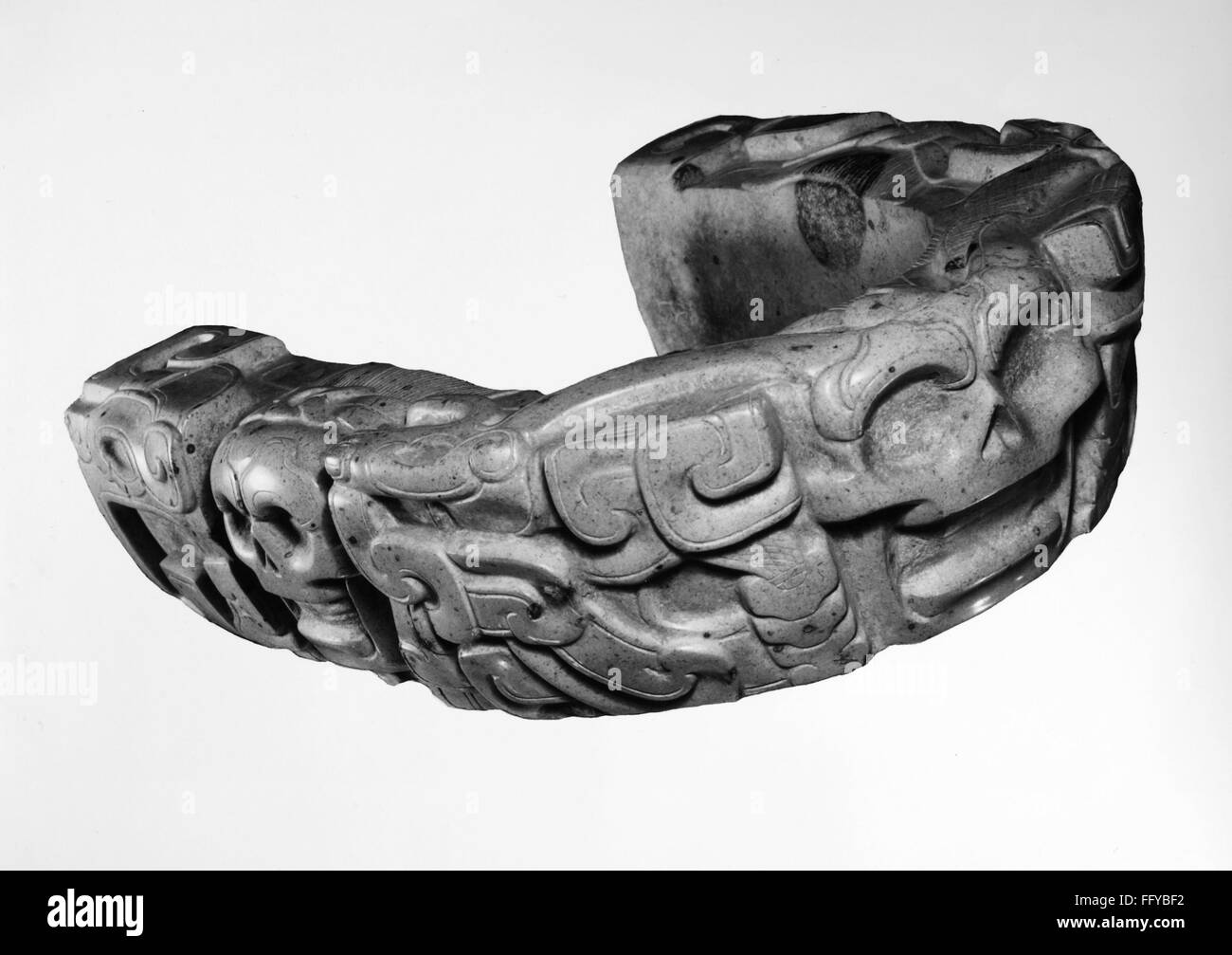 MEXICO: YUGO. /nCarved stone yugo (yoke) with skeletal faces, from ...