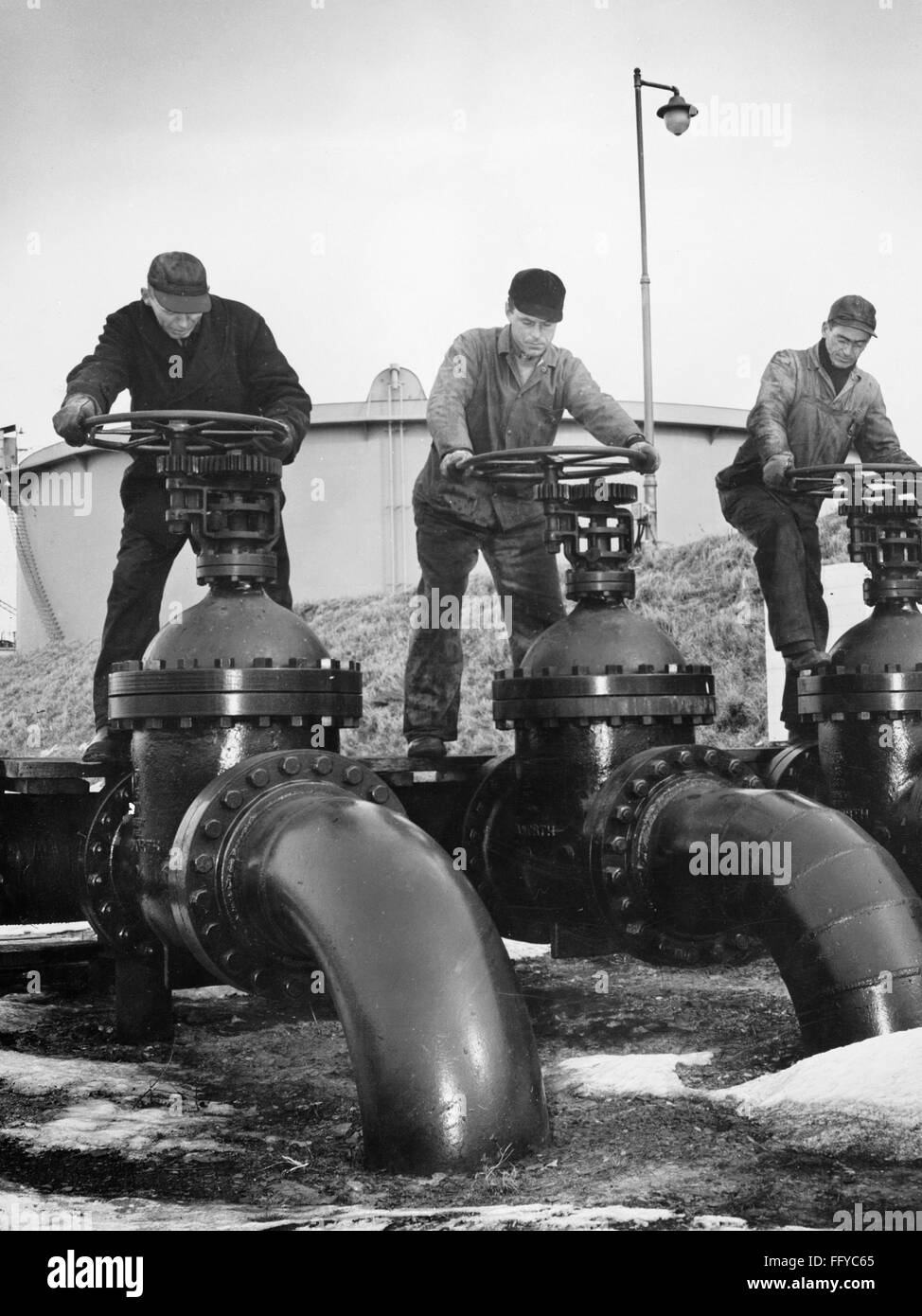 INDUSTRY: OIL, c1944. /nWorkers regulate the flow of oil into oil ...