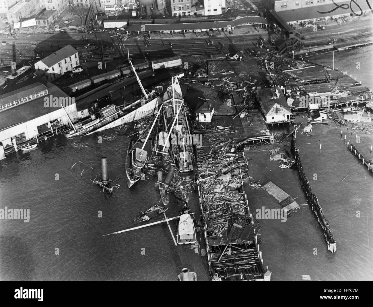 CONNECTICUT: HURRICANE, 1938. /nAerial view of docks at New London ...
