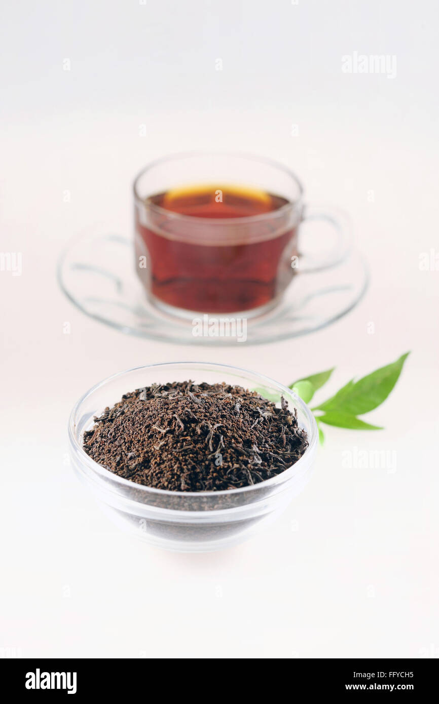Tea dust in pot with tea cup on white background Stock Photo - Alamy