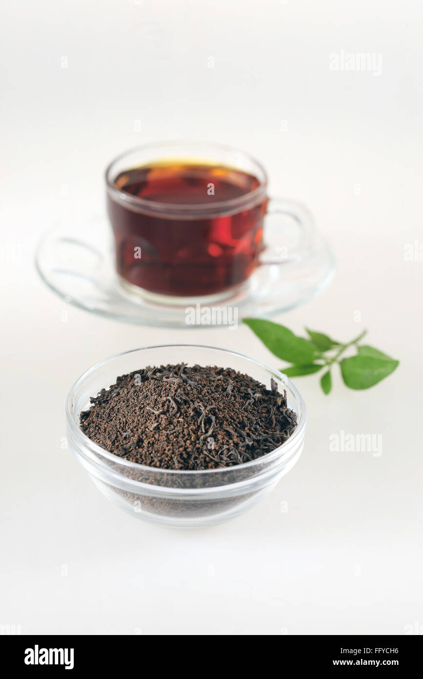 Tea dust in pot with tea cup on white background Stock Photo - Alamy