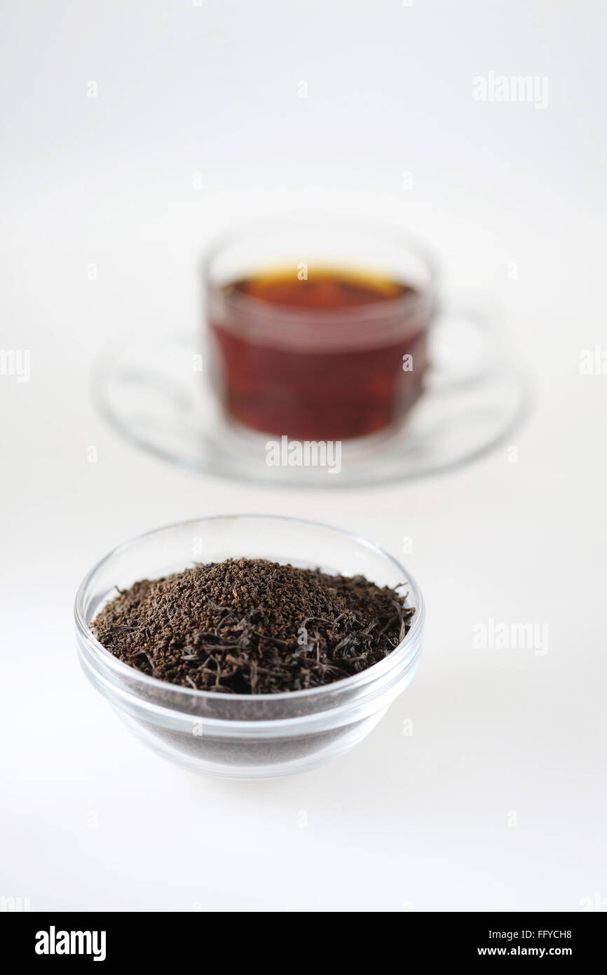 Tea dust in pot with tea cup on white background Stock Photo - Alamy