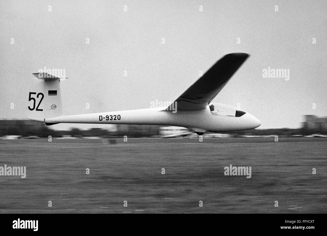 GLIDER COMPETITION. /nA single-seat glider in flight during a ...