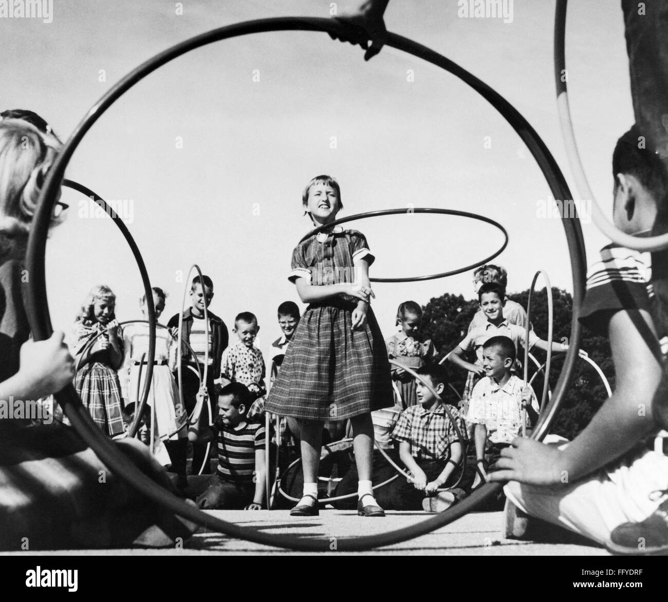 Hula hoop play Black and White Stock Photos & Images - Alamy