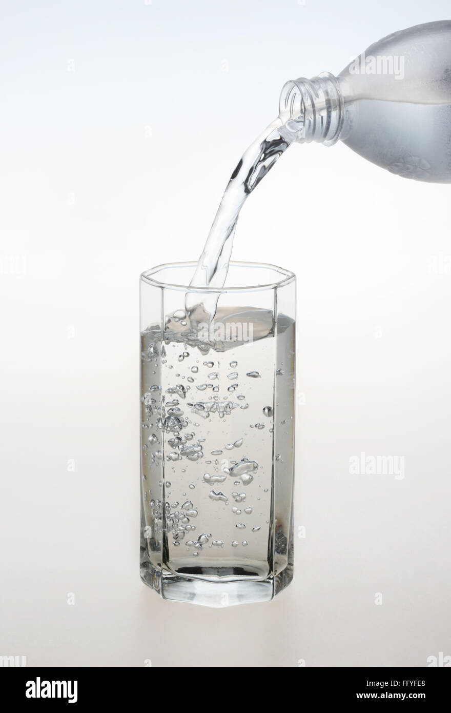 Pouring water in transparent crystal glass ; India Stock Photo - Alamy