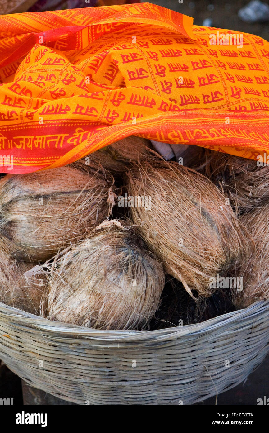 Coconut in basket with Hindu ritual clothe Jay Shree Rama in Varanasi ...