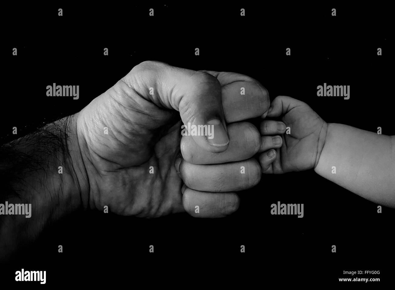 Baby fist bump Black and White Stock Photos & Images - Alamy