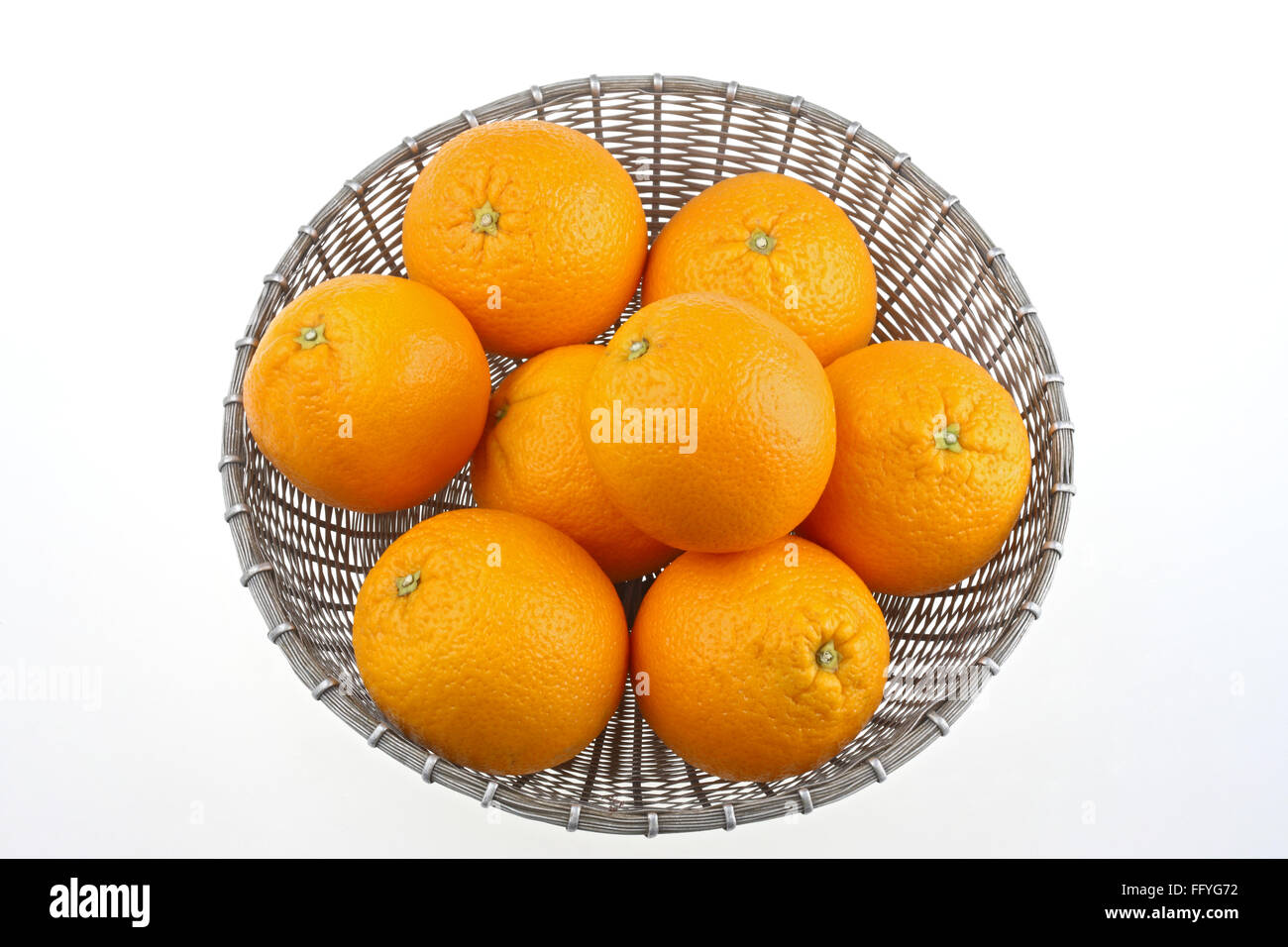 Eight oranges in a metal basket citrus reticulata clementin rutaceae ...