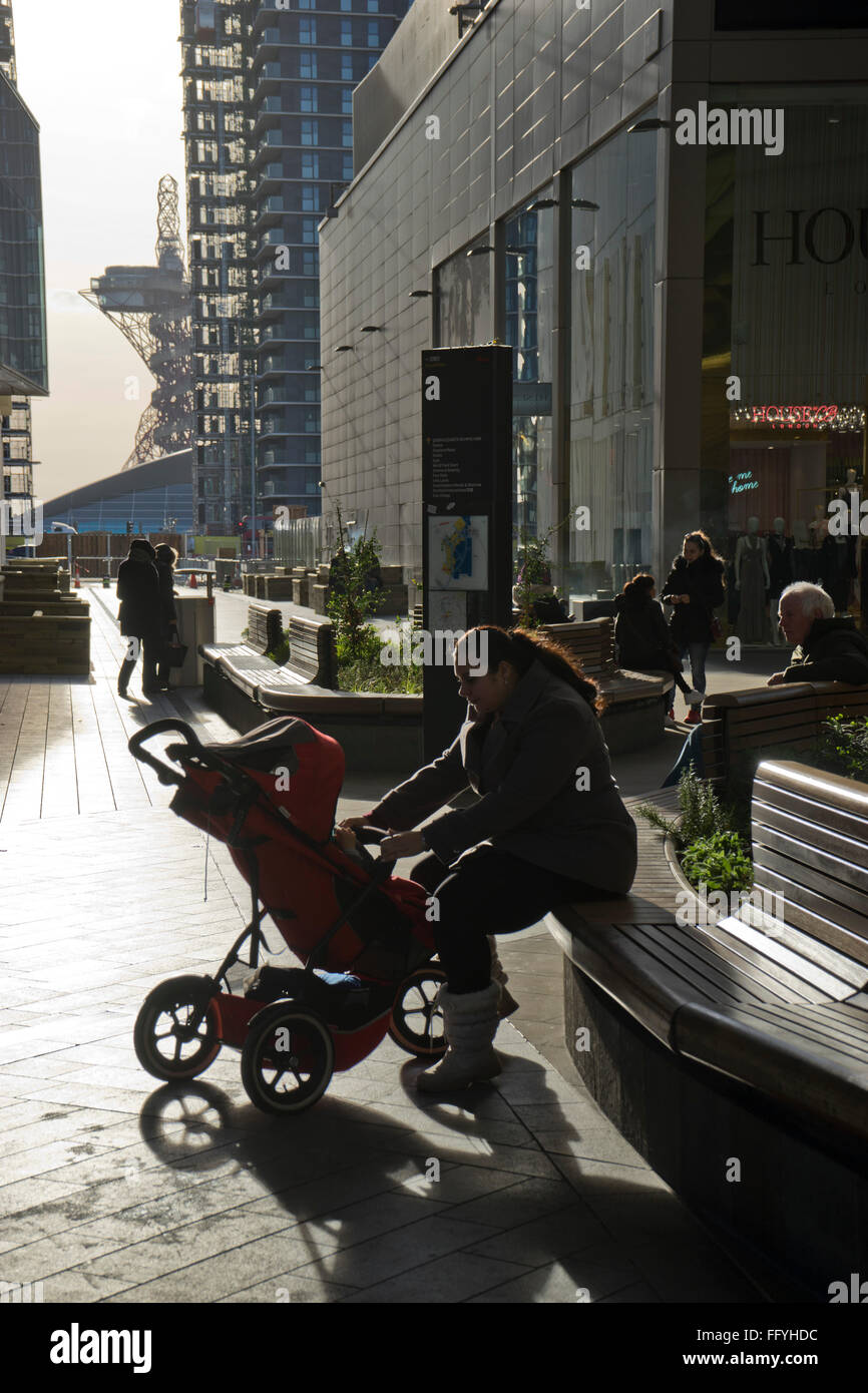 Woman with child in pram outside Westfield shopping mall by the Queen ...