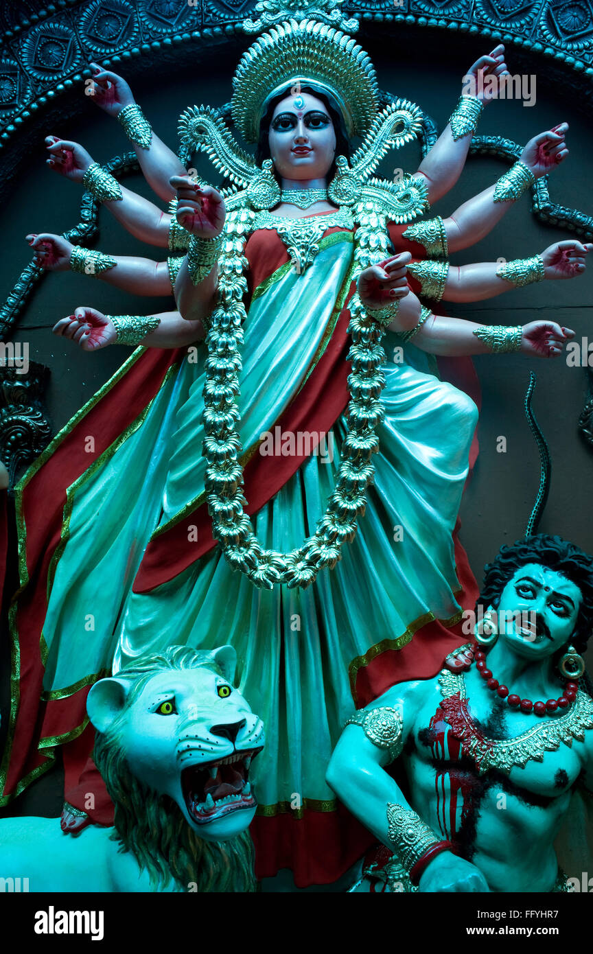Goddess durga mounted on lion killing demon mahishasura on durga puja ...