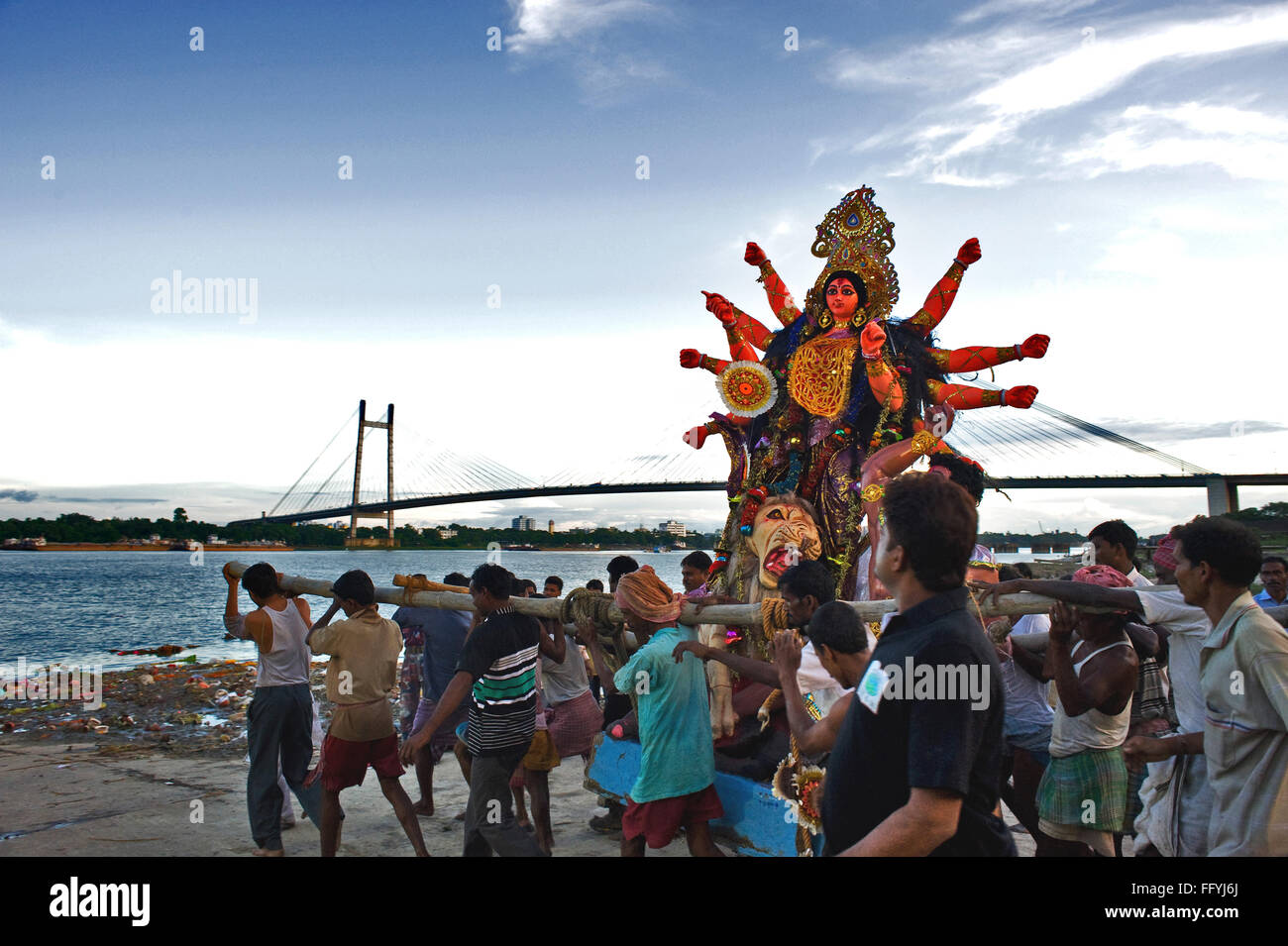 People carrying idol of goddess durga for immersion on durga puja ...