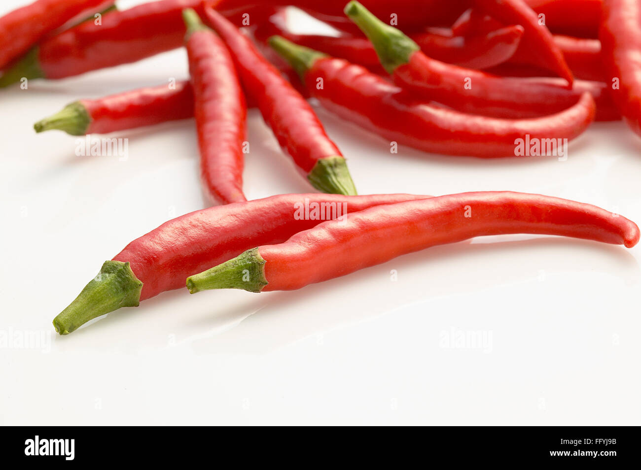 Spice , red chillies on white background Stock Photo - Alamy