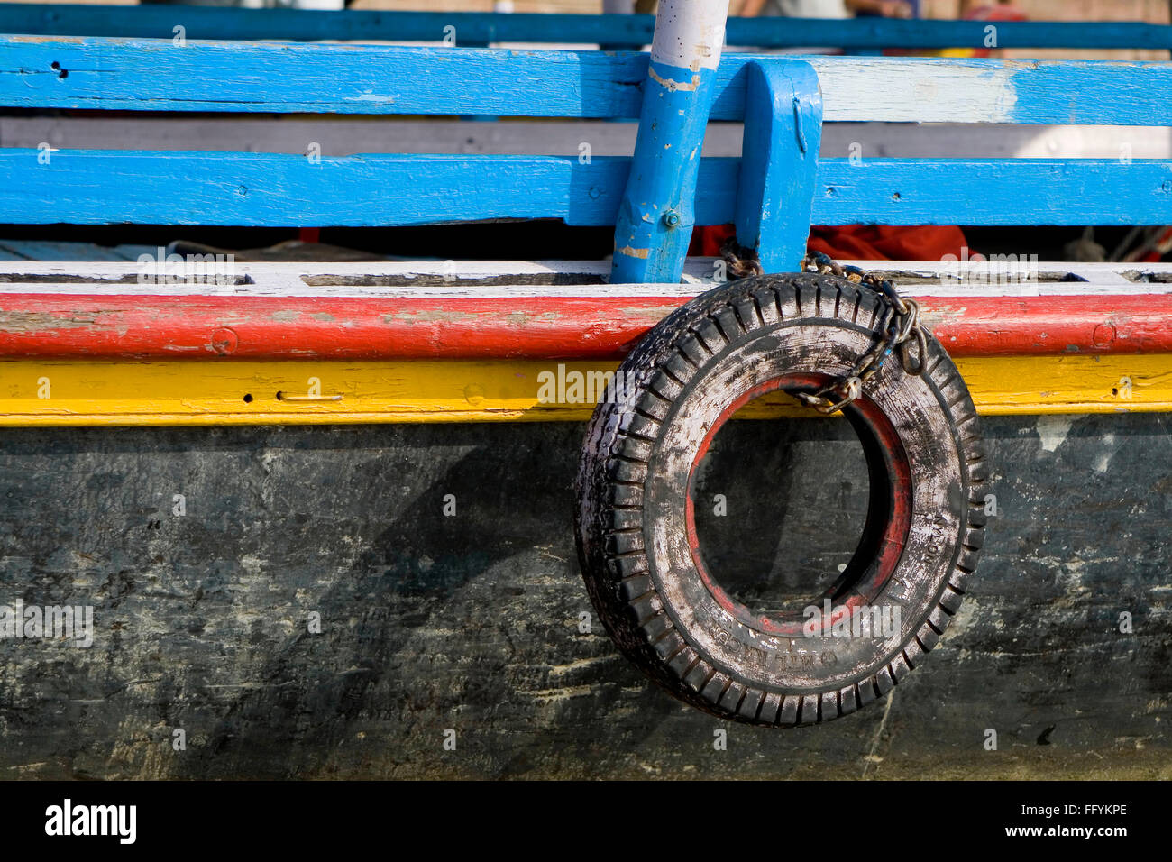 Tire tied on outside of boat Stock Photo - Alamy