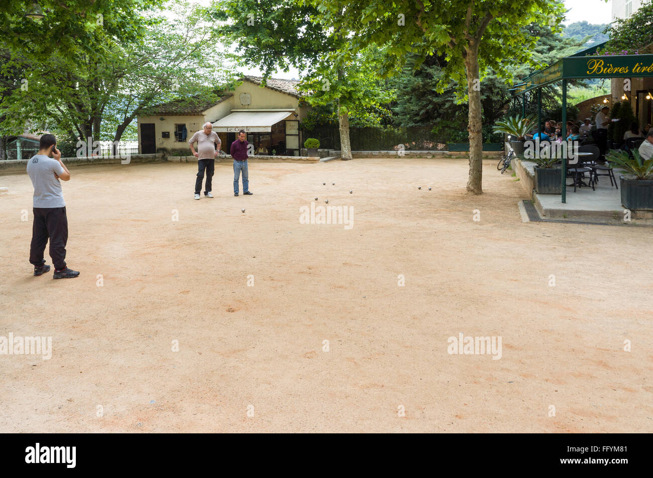 Group of french men playing boule in the small village of Saint Paul de ...