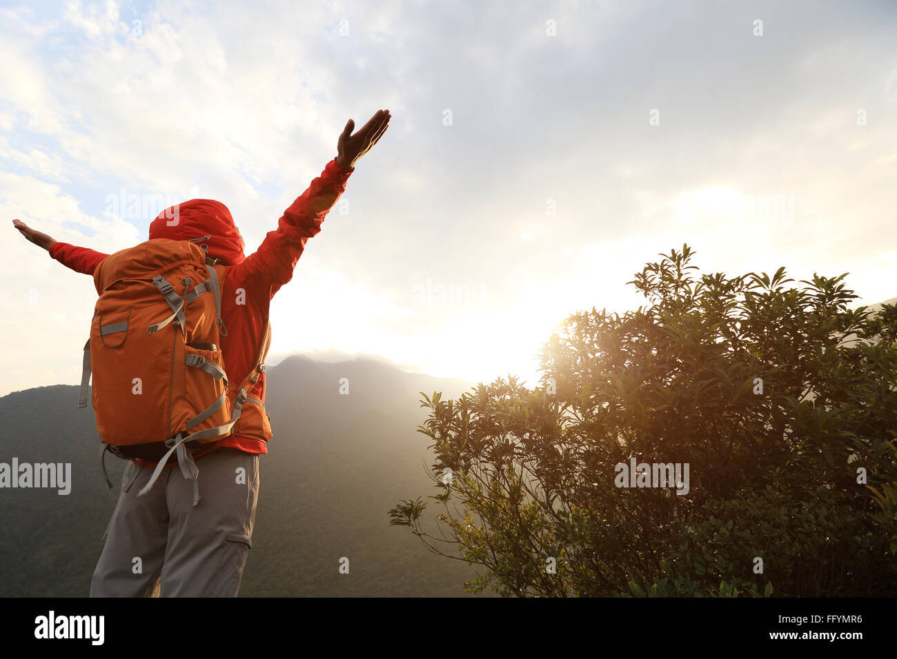 Cheering woman outstretched arms mountain hi-res stock photography and ...