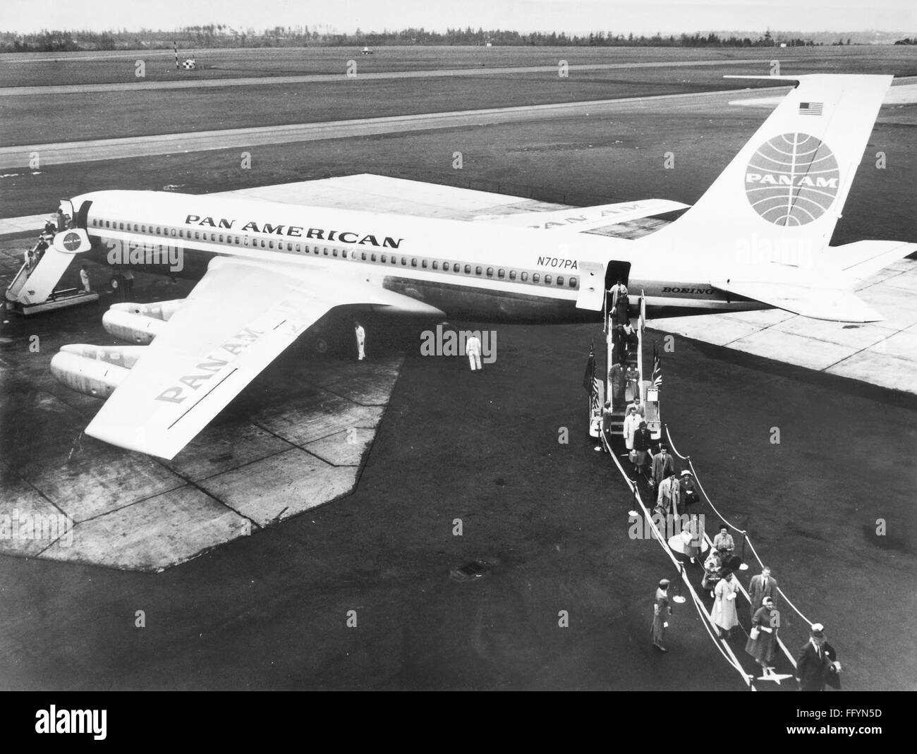 BOEING 707 PLANE, 1958. /nPassengers disembarking from a Boeing 707-121 ...