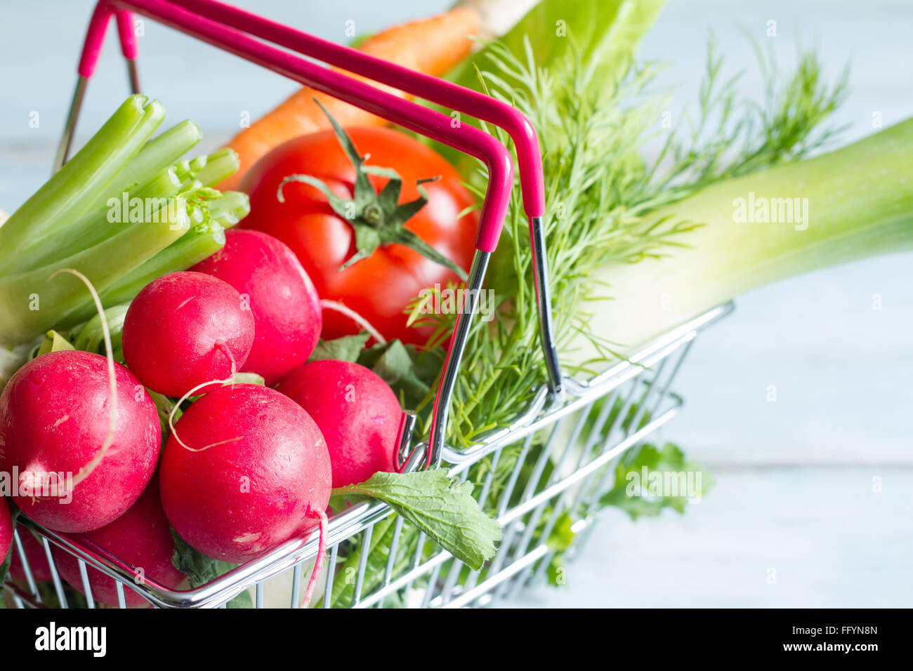 Spring vegetables in shopping basket closeup Stock Photo - Alamy