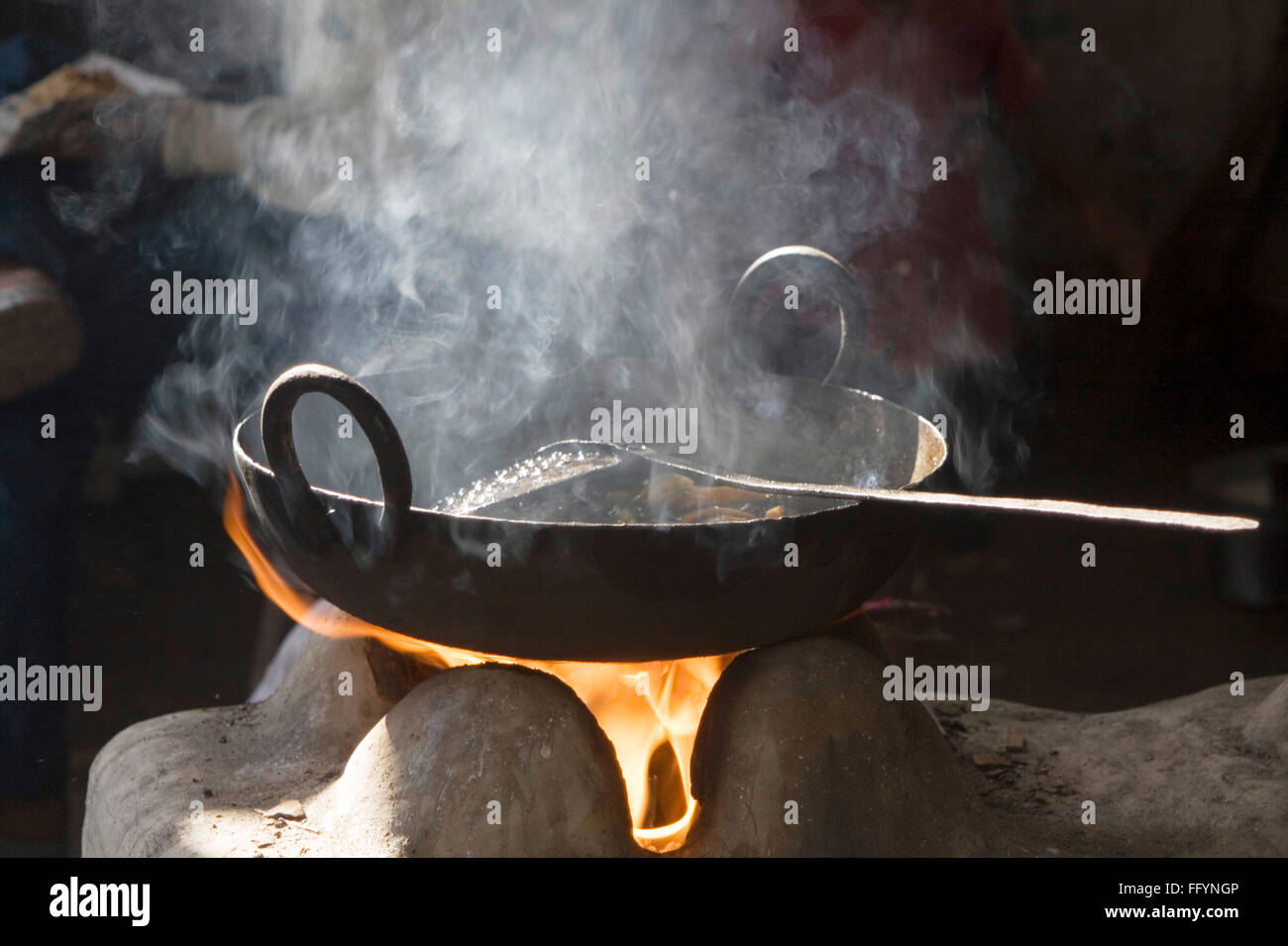Vessel on wood fire Stock Photo - Alamy