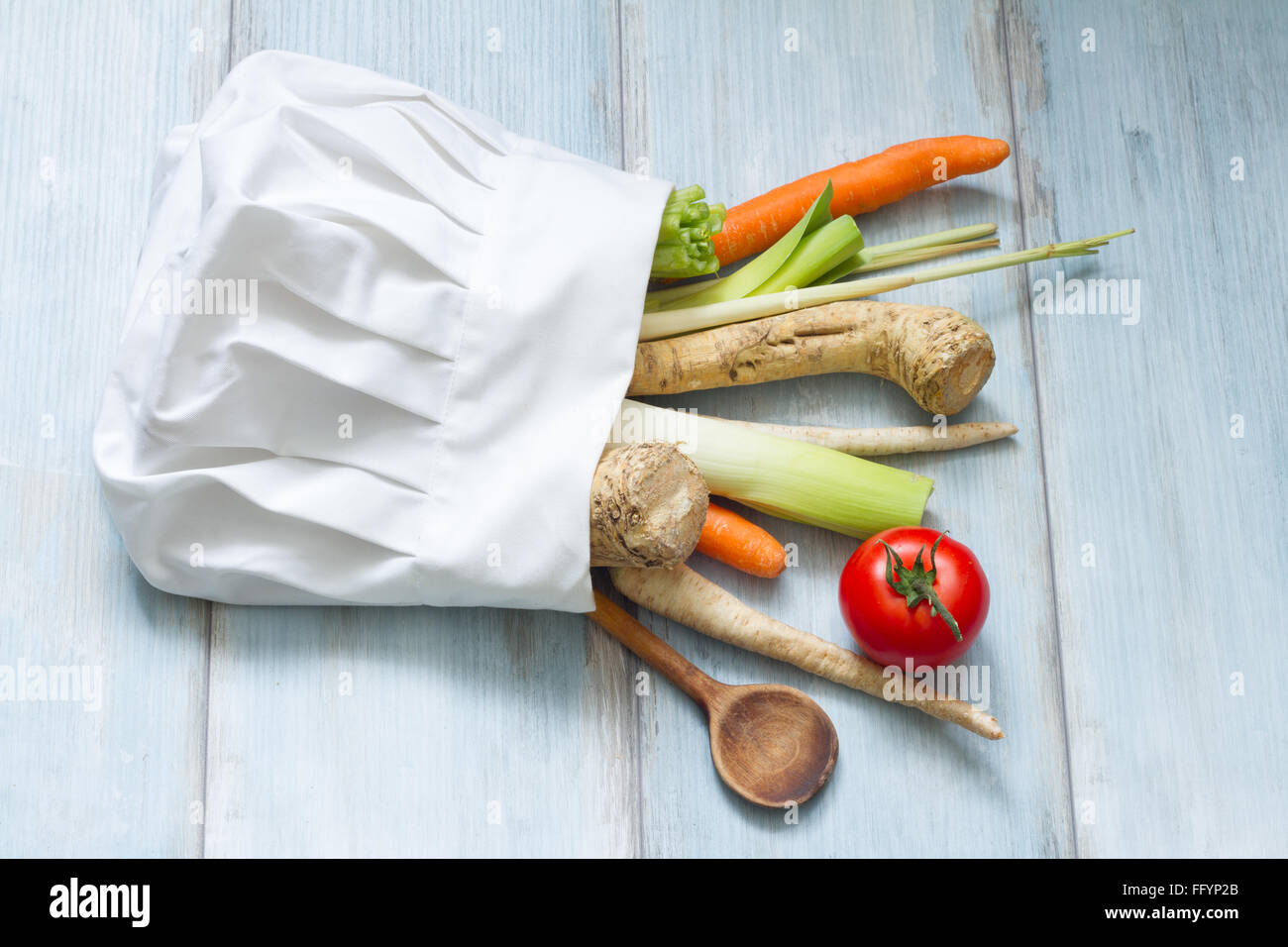 Vegetables in chef's hat cooking food abstract concept Stock Photo - Alamy
