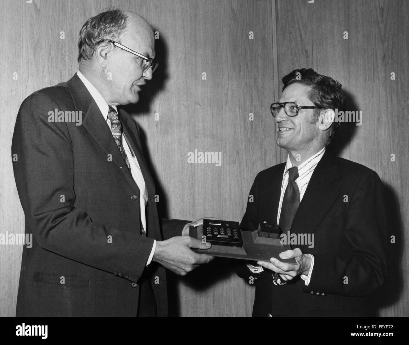 HAND-HELD CALCULATOR, 1975. /nAmerican inventor Jack Kilby (left ...