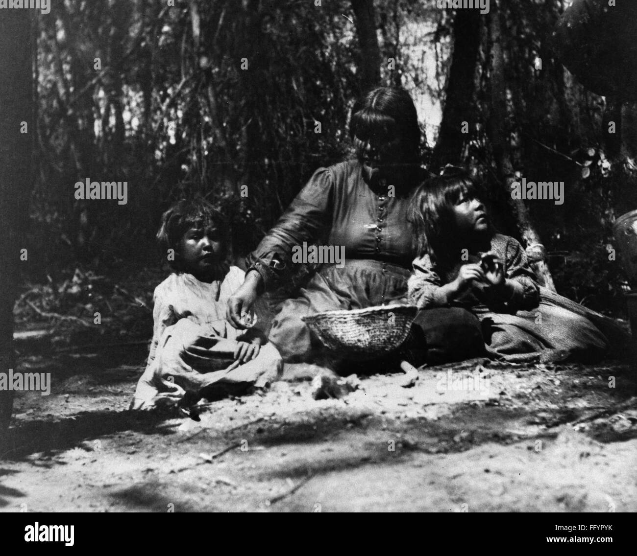 POMO WOMAN & CHILDREN. /nA Pomo Native American woman shelling acorns ...