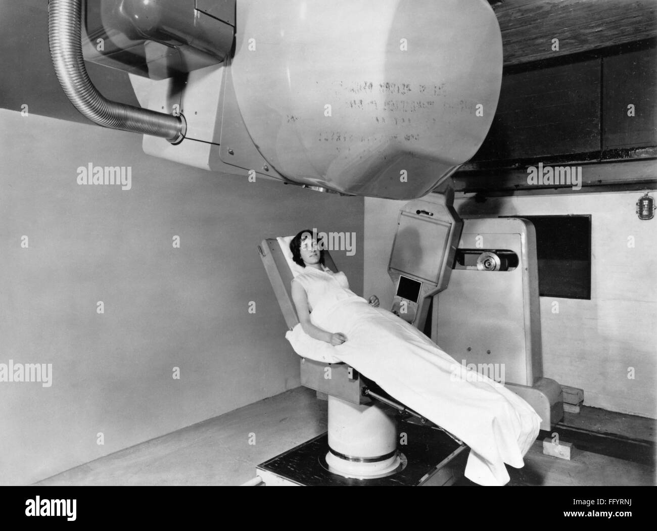 RADIATION THERAPY, c1962. /nA woman receiving radiation therapy at ...