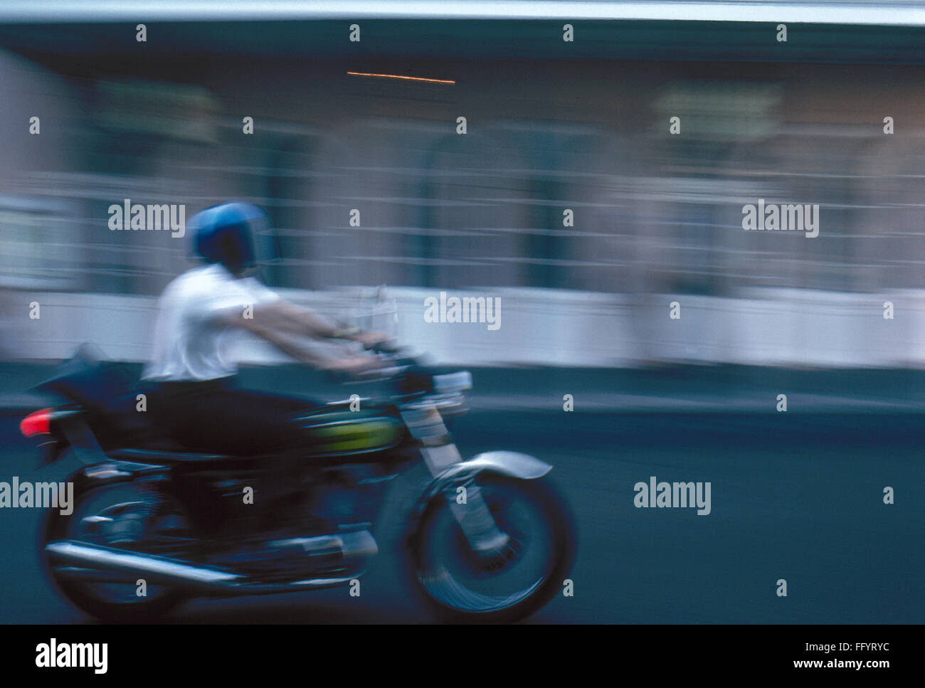 NEW ORLEANS: MOTORCYCLE. /nA man riding a motorcycle on a street in New ...