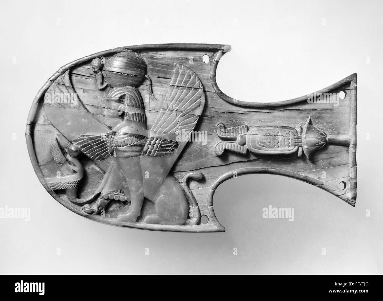 ASSYRIA: HORSE BLINDER. /nCarved ivory horse blinder depicting a winged ...
