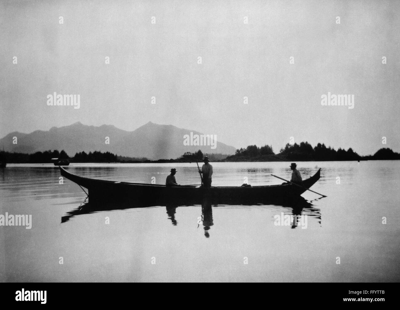ALASKA: DUGOUT CANOE, 1905. /nTlingit Native American men in a large ...