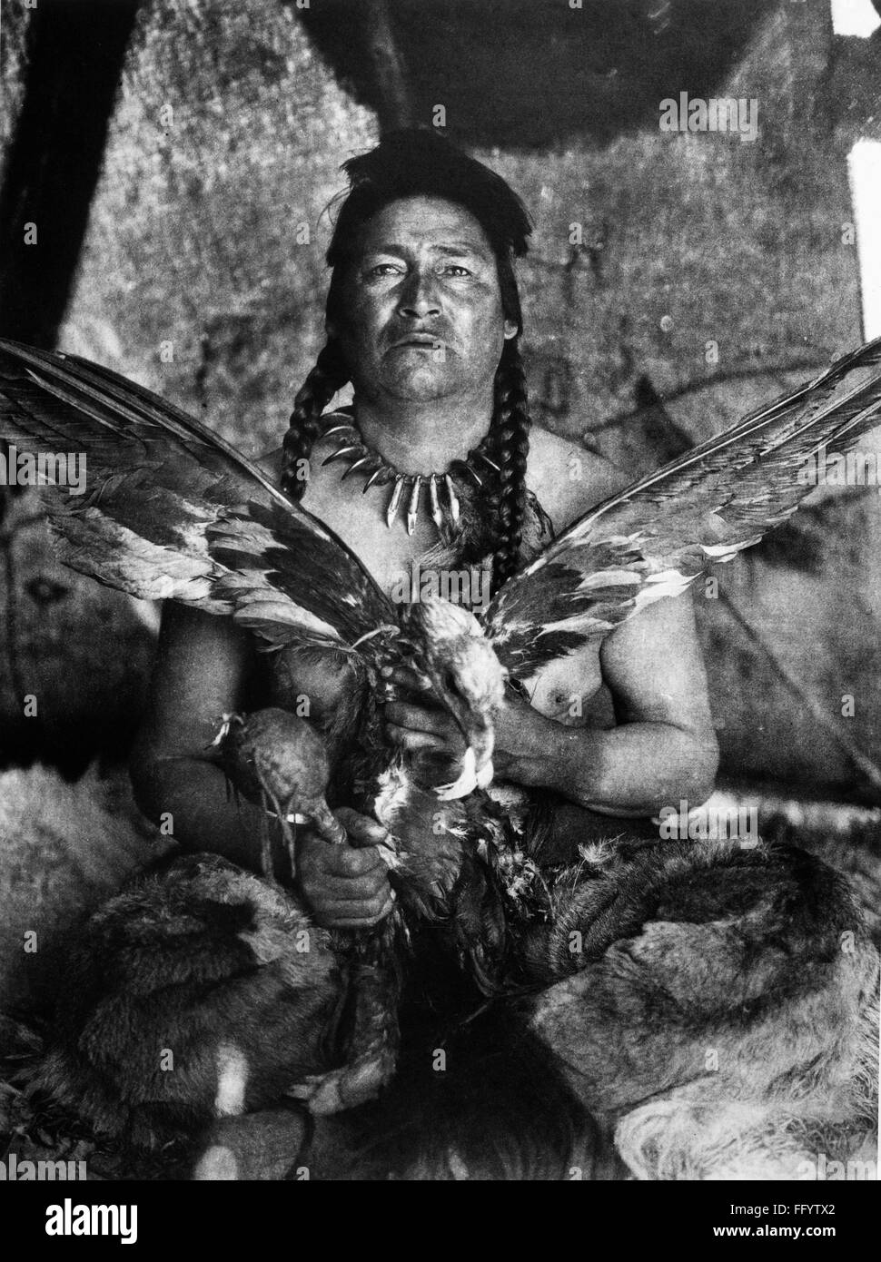 ASSINIBOIN AND EAGLE, 1926. /nAn Assiniboin man placating the spirit of ...