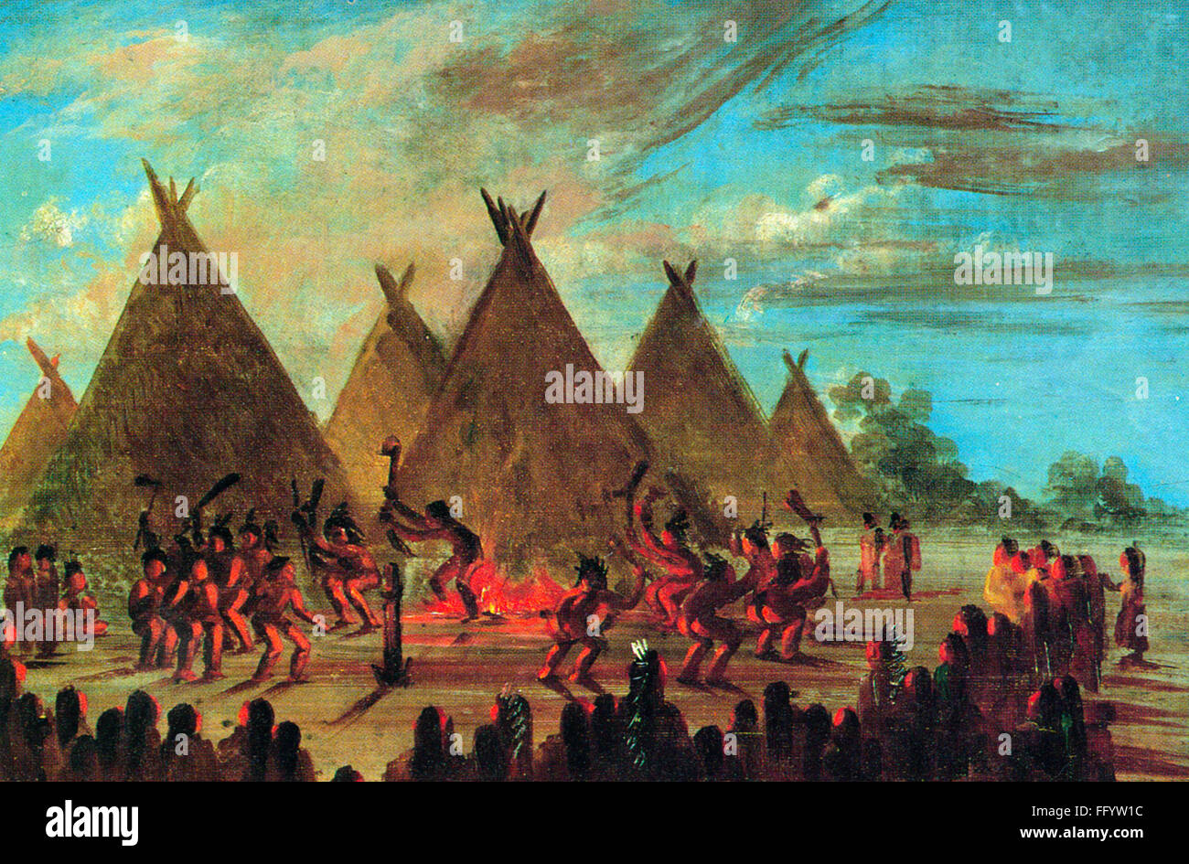 SIOUX WARRIOR DANCE./nA group of Sioux warriors dance around a fire to ...