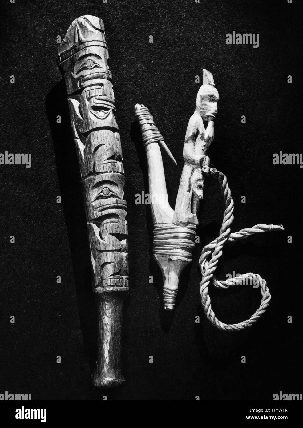 TLINGIT FISH CLUB AND HOOK. /nCarved wooden fish club (left) and fish ...