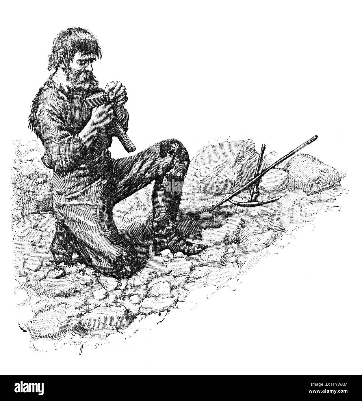 GOLD RUSH: PROSPECTOR. /nA prospector examines a nugget of gold in the ...