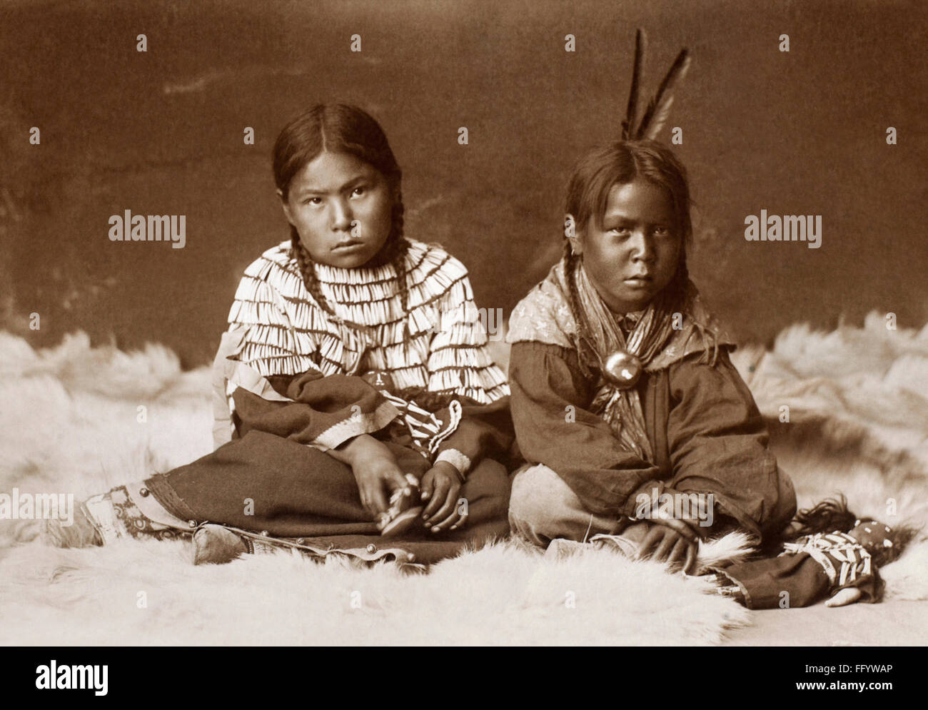 CHEYENNE CHILDREN, c1890. /nA Cheyenne girl and boy, with their dolls ...