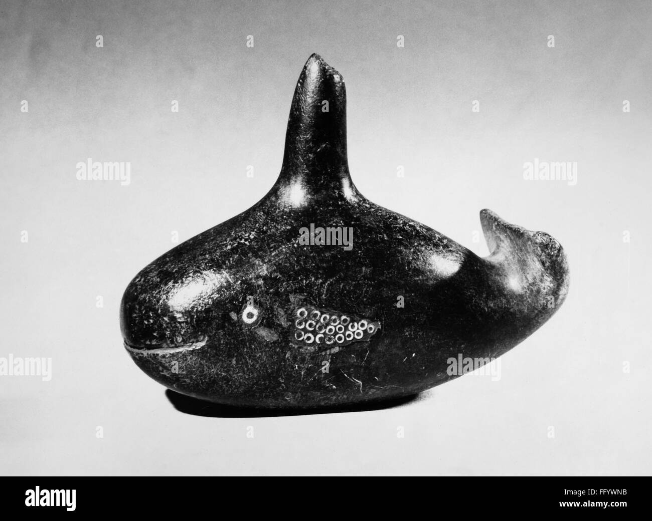PRE-COLUMBIAN WHALE EFFIGY. /nSteatite figure of a killer whale, with ...