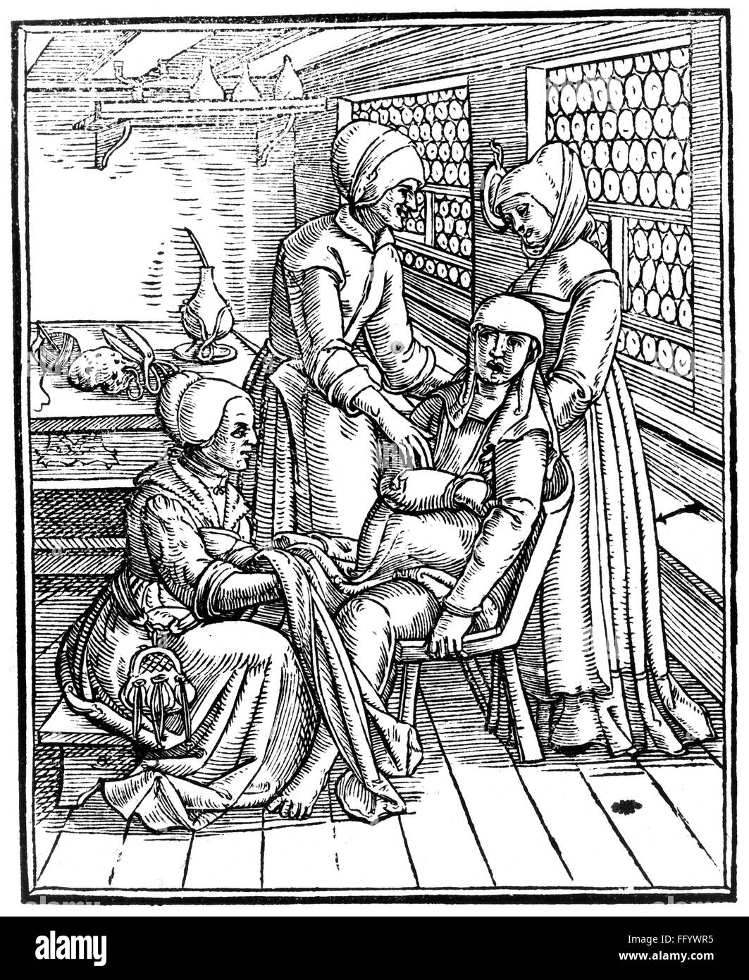 OBSTETRICAL CHAIR. /nA woman giving birth with the aid of midwives and ...