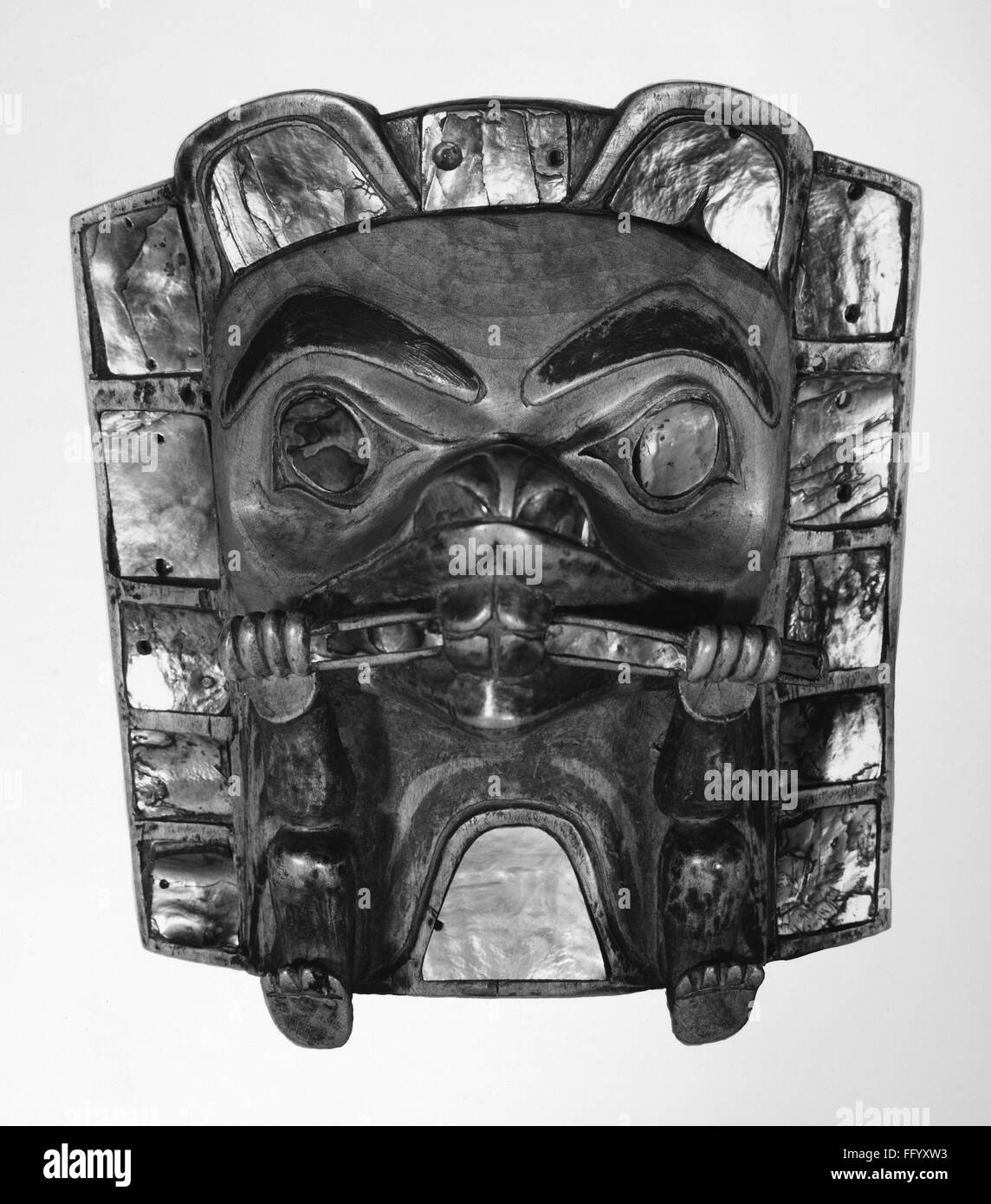 NATIVE AMERICAN FRONTLET. /nCarved and painted wooden frontlet with ...