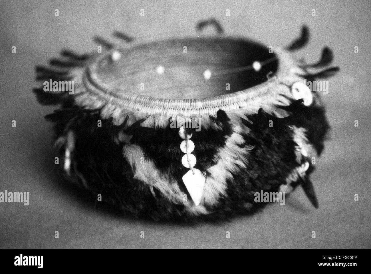 NATIVE AMERICAN BASKET. /nPomo basket decorated with feathers, shell ...
