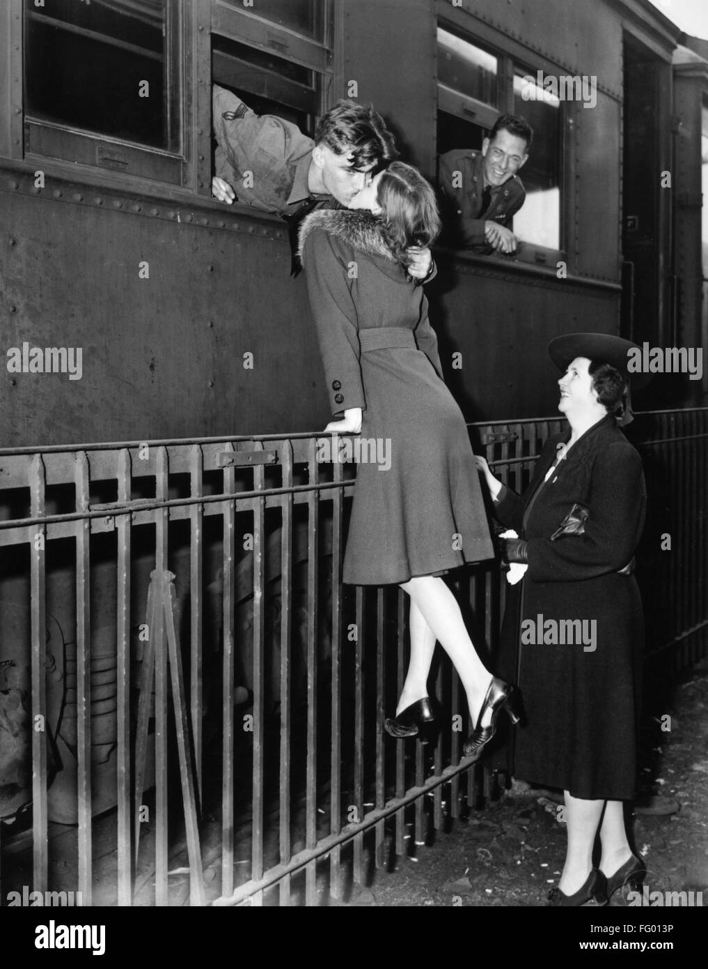 WORLD WAR II: FAREWELL. /nA U.S. soldier kisses a woman goodbye at a ...