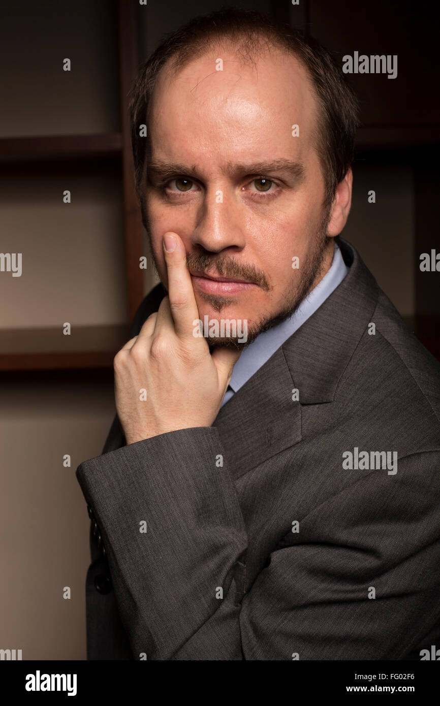 business man in home office with thoughtful look Stock Photo - Alamy