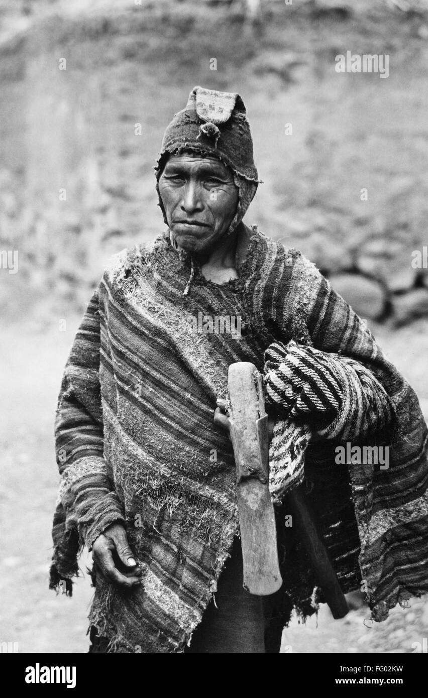 PERU: NATIVE MAN, c1965. /nA native Peruvian man holding a wooden tool ...