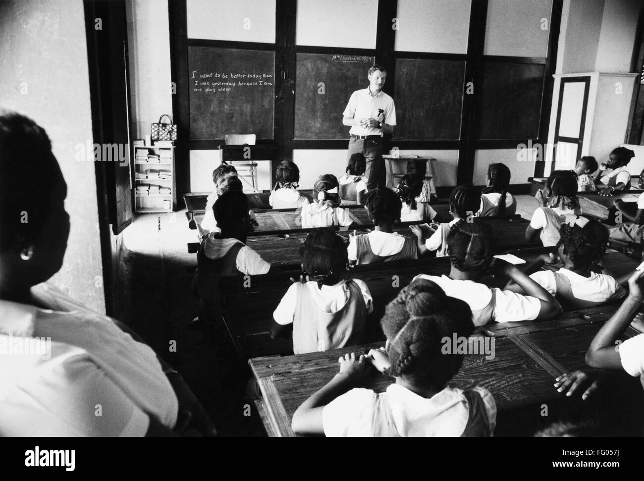 PEACE CORPS: EDUCATION./nPeace Corps volunteer teaching in a classroom ...