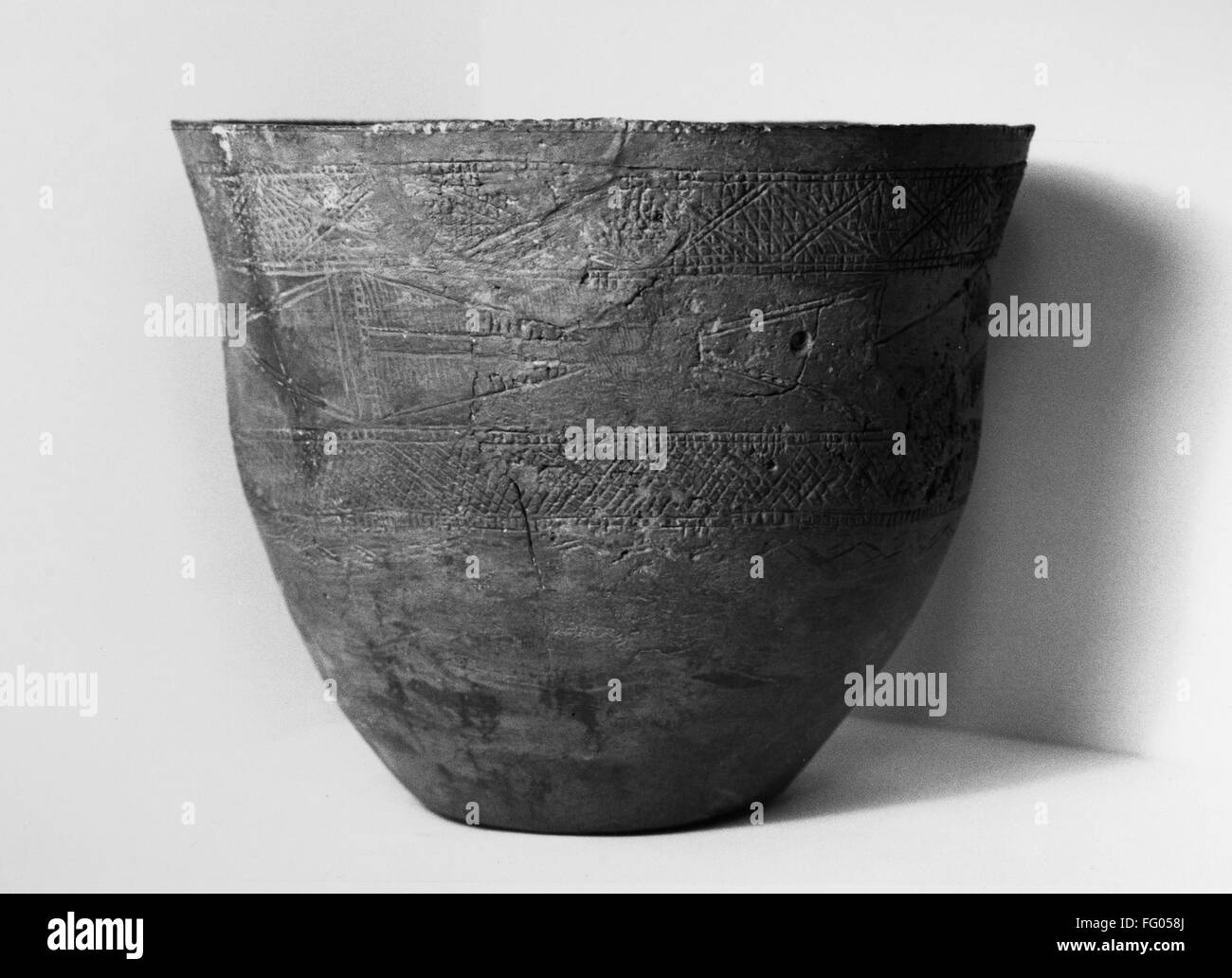 PRE-COLUMBIAN POTTERY. /nCeramic vessel with incised designs, excavated ...