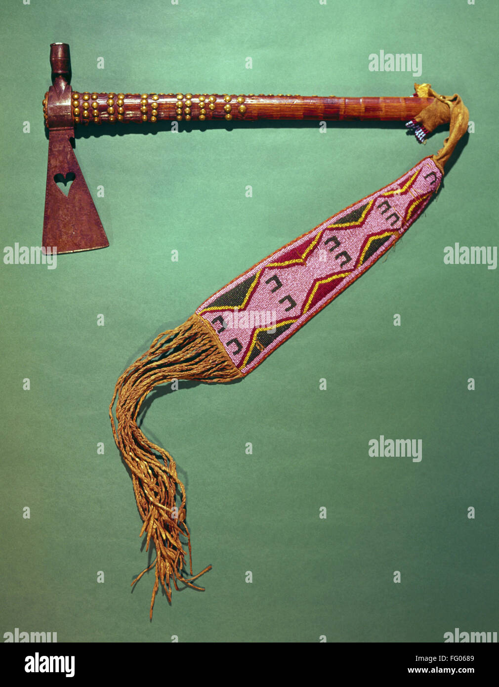 SIOUX PIPE TOMAHAWK. /nSioux 'weeping heart' pipe tomahawk, with brass ...