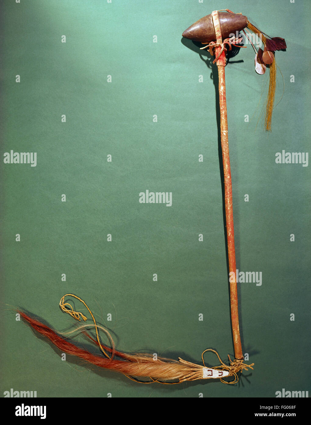 NATIVE AMERICAN CLUB. /nDouble-pointed stone-headed war club with dyed ...