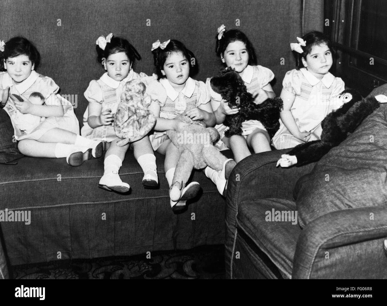 DIONNE QUINTUPLETS, 1939. /nThe Dionne quintuplets in a train car on a ...